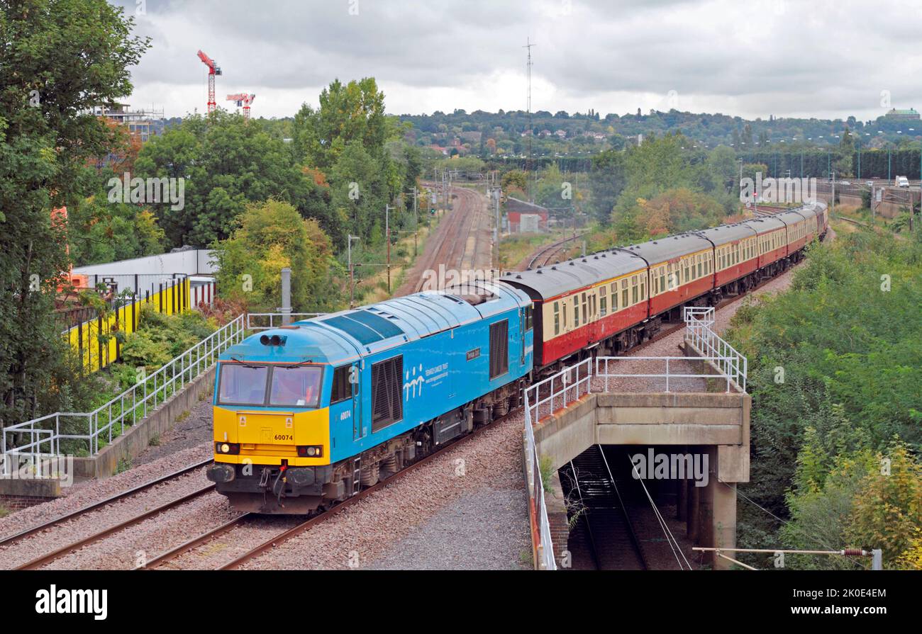 A Class 60 diesel locomotive number 60074 with a train of empty ...