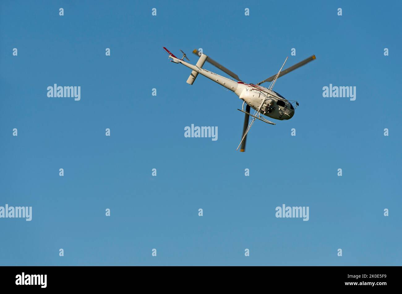 Helicopter With Mounted Spraying Rods In Flight, Valais, Switzerland ...