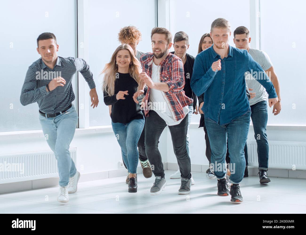 group of diverse young people running forward Stock Photo - Alamy