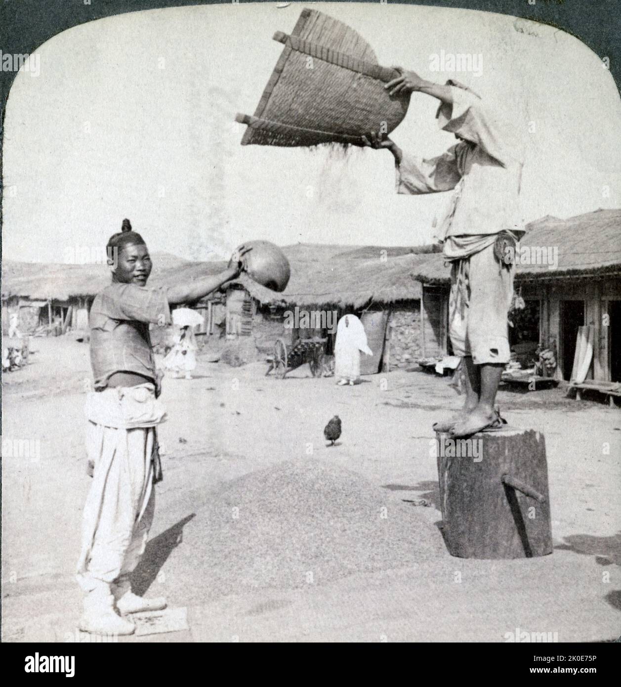 Joseon Era, Korea, 1890-1900. Street scene showing winnowing of barley ...