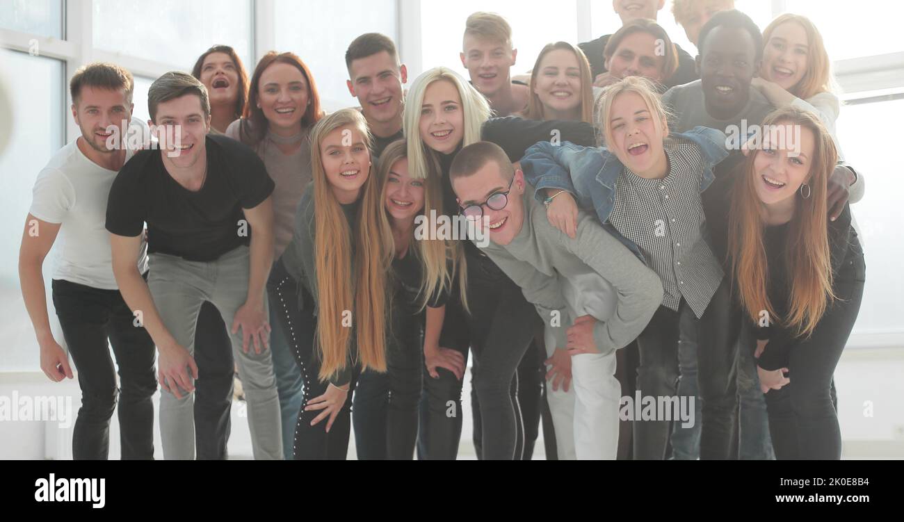 in full growth. group of cheerful friends standing together Stock Photo ...