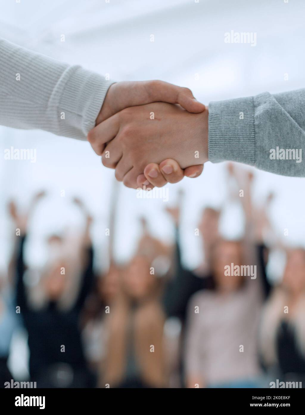 close up. a firm handshake on a blurred business background Stock Photo ...