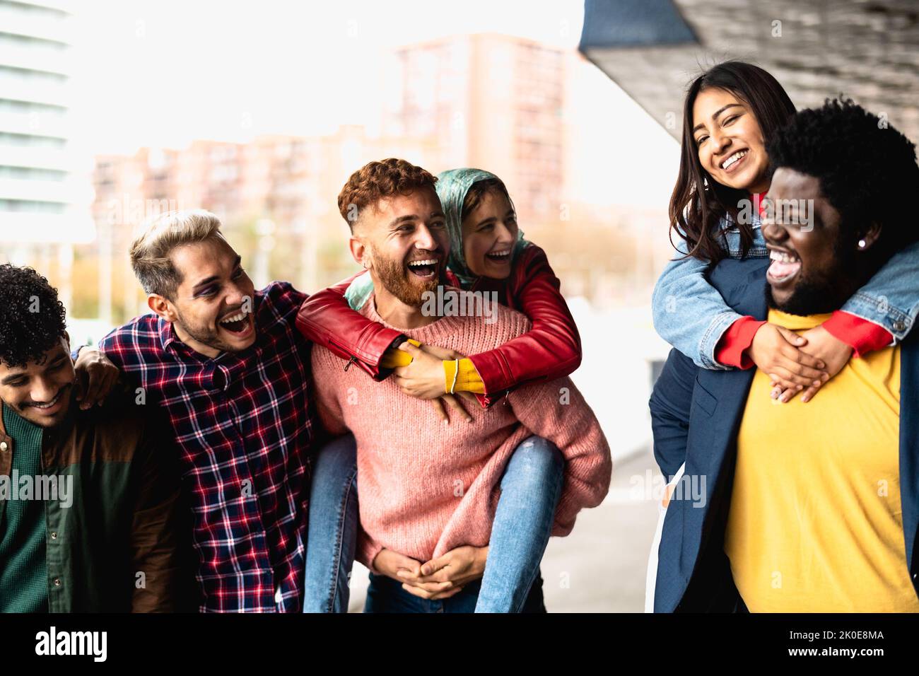 Young multi ethnic friends having fun together hanging out in the city ...