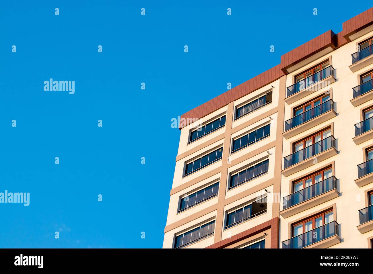Modern apartment on a sunny day. Exterior, residential house facade ...