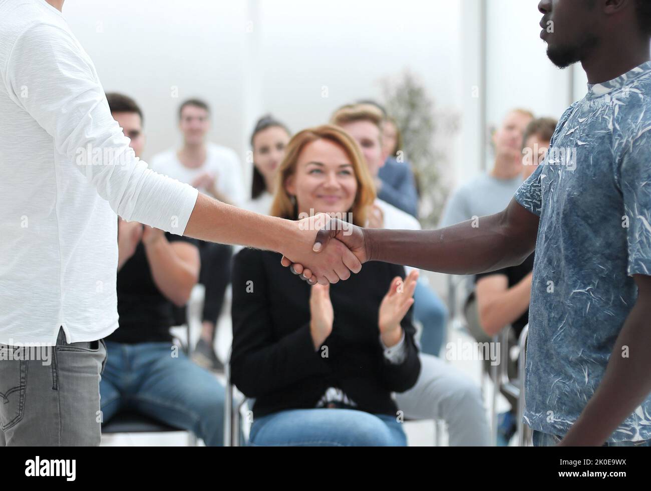 Group shake hands speaker hi-res stock photography and images - Alamy