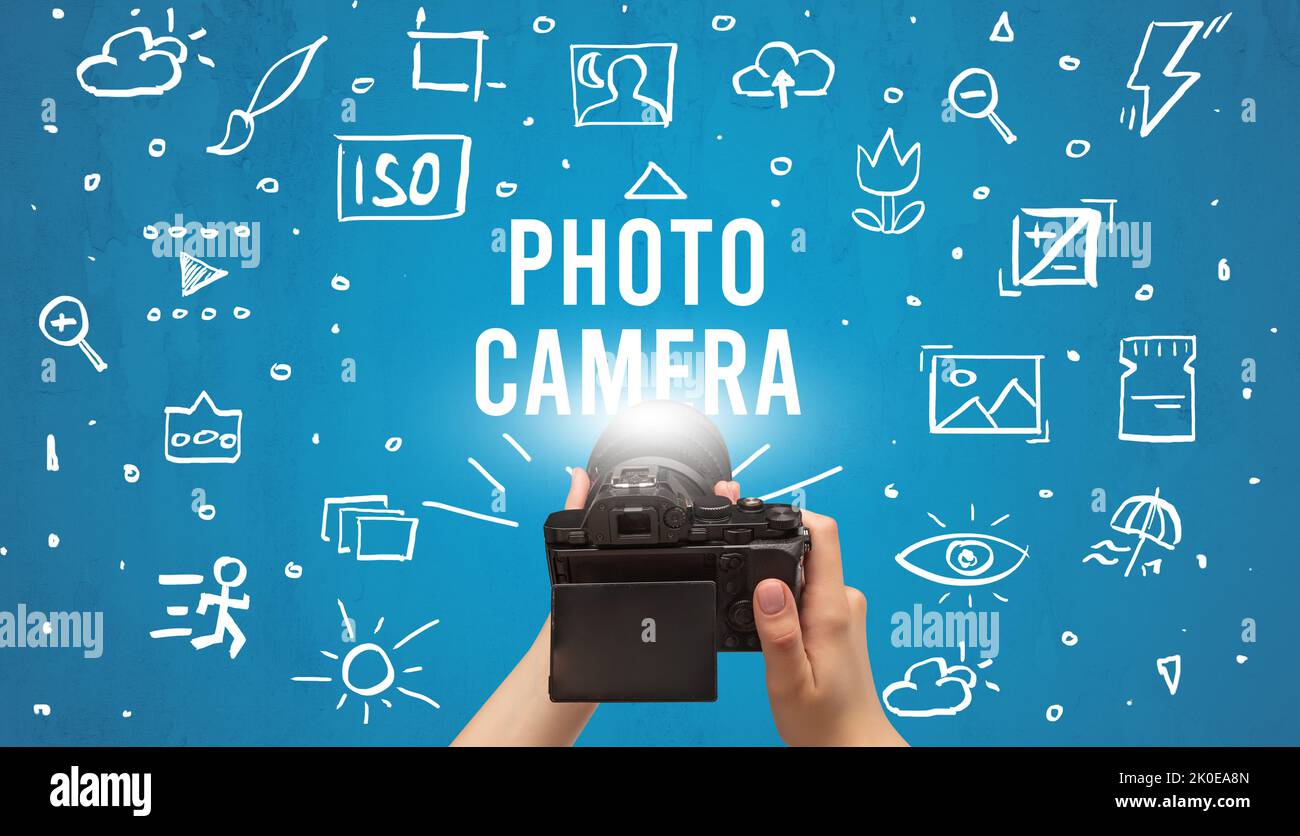 Hand taking picture with digital camera Stock Photo - Alamy