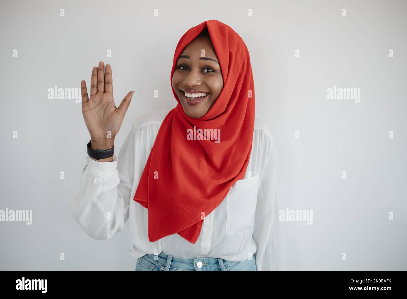 Hello gesture. Cheerful african american muslim woman in hijab waving ...
