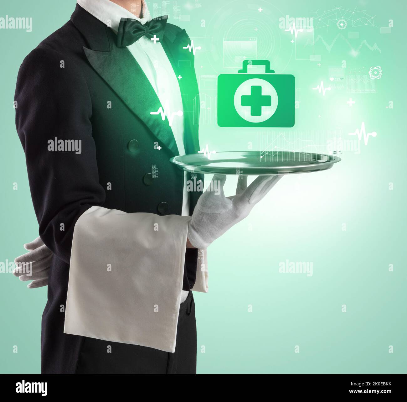 Handsome young waiter in tuxedo holding healthcare icons on tray Stock ...
