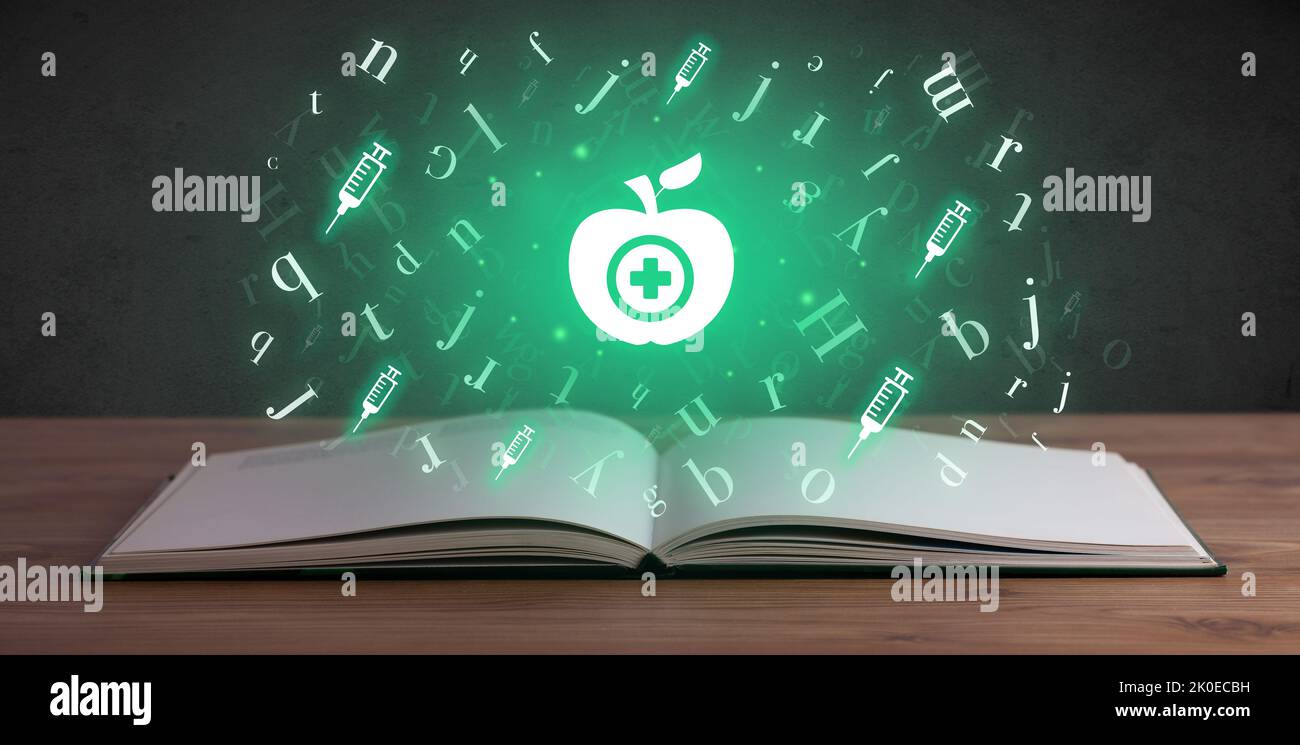 Open medical book with health icons above Stock Photo - Alamy