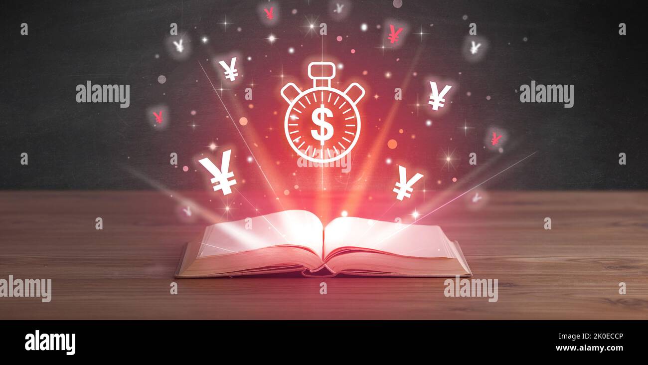 Open book with currency icons above Stock Photo - Alamy