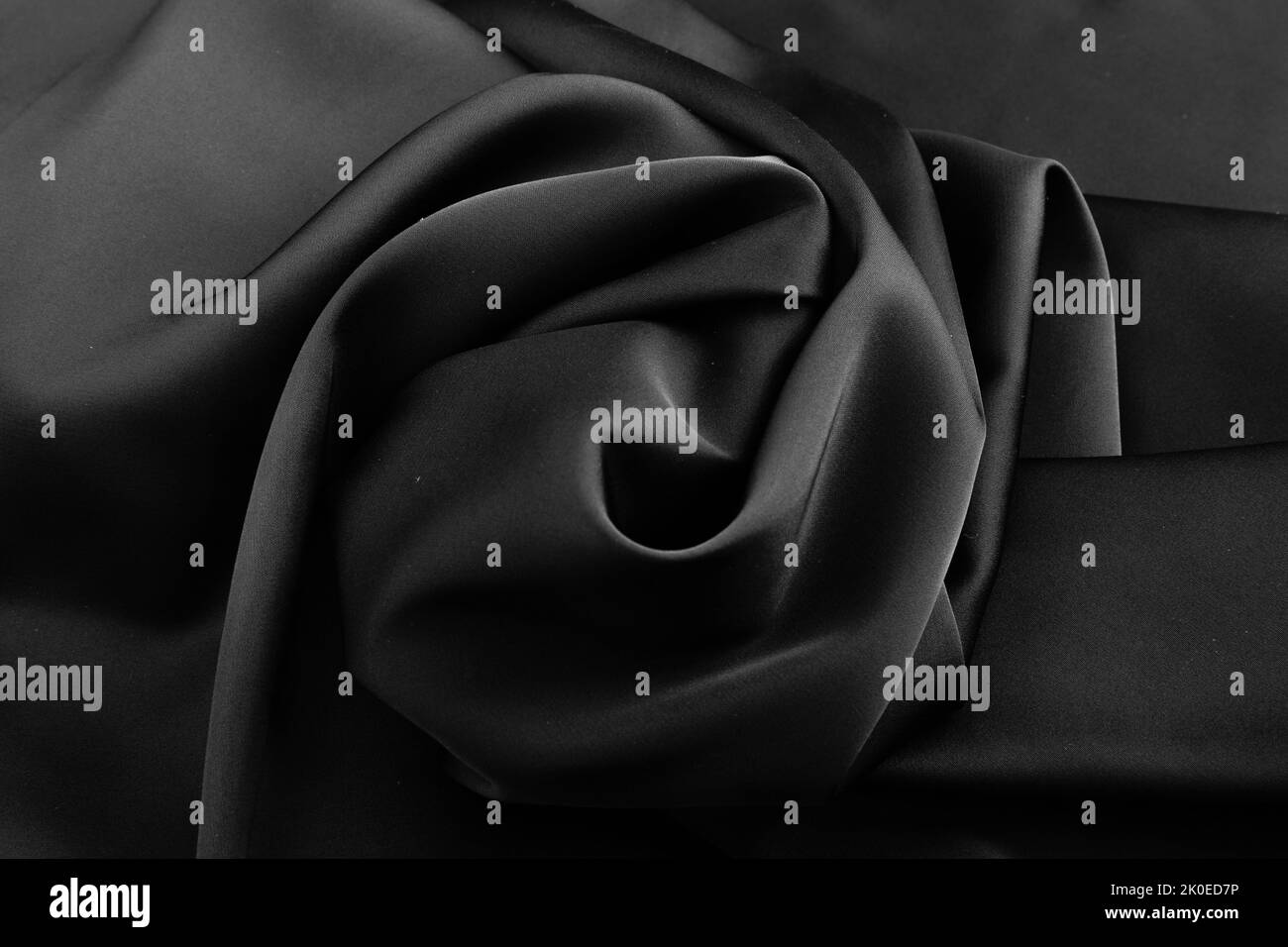 Folds of black silk fabric Stock Photo - Alamy