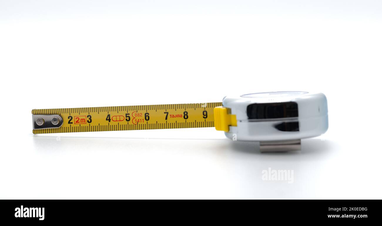 Tape measure for measuring, white background, cropped image Stock Photo ...
