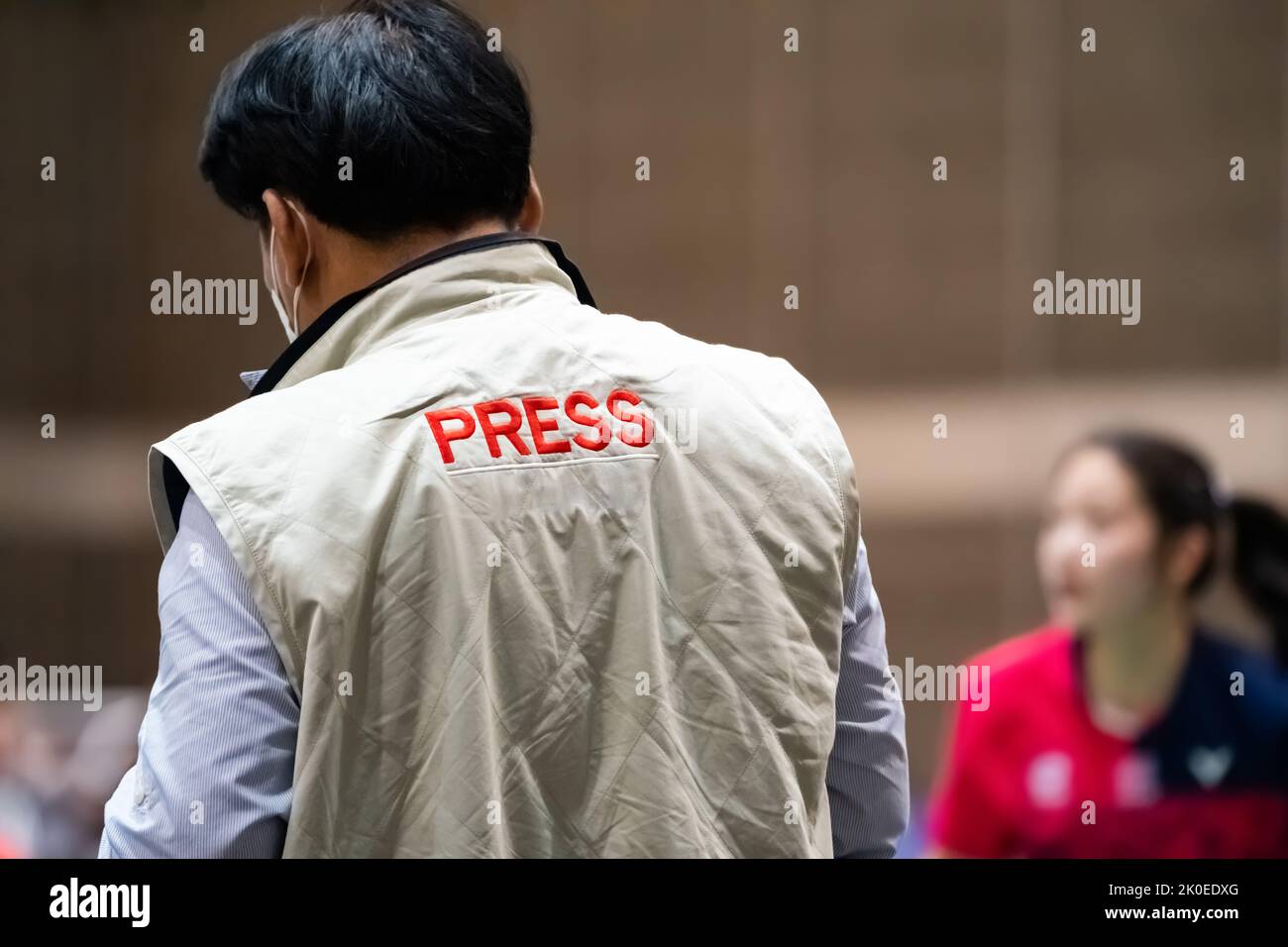 People watching behind news reporter hi-res stock photography and ...