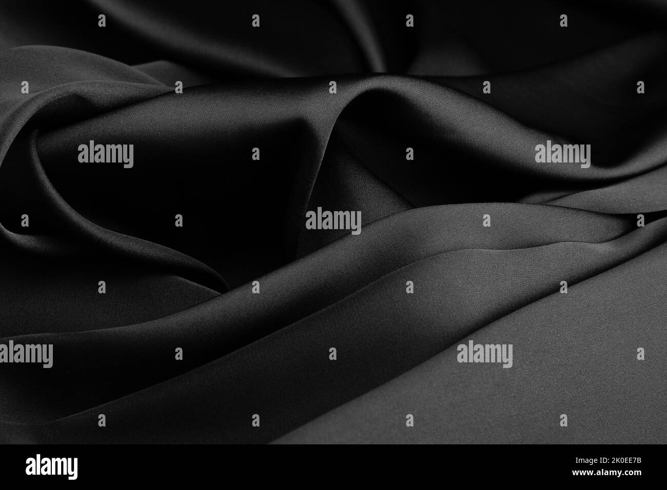 Folds of black silk fabric Stock Photo - Alamy