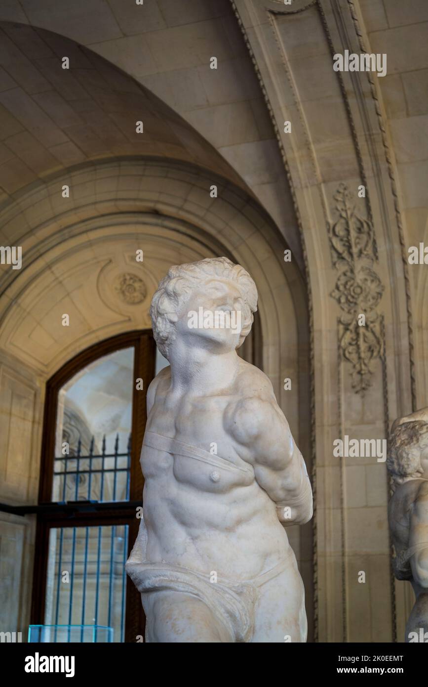 The Rebellious Slave is a 2.15m high marble statue by Michelangelo ...