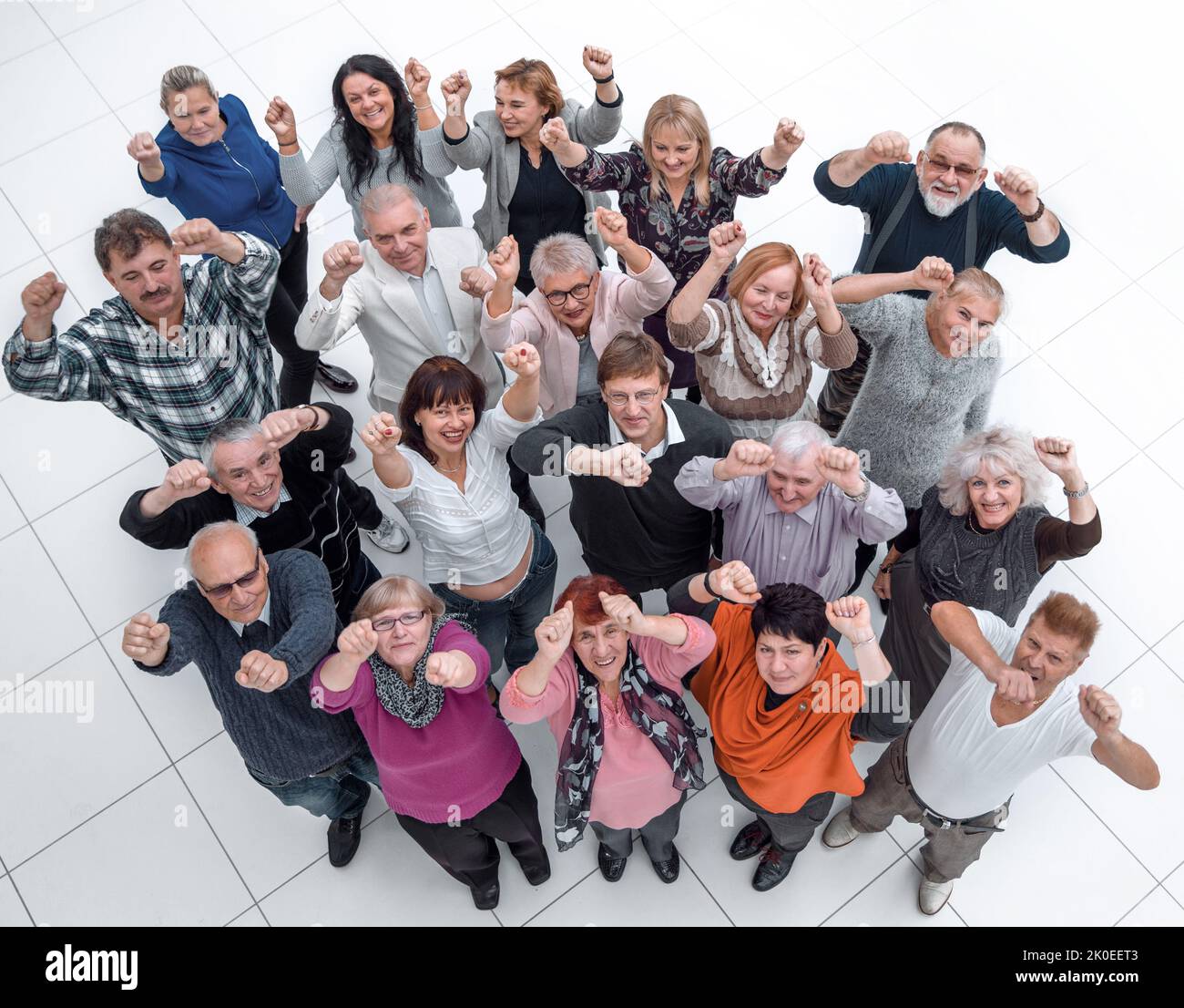 group of confident mature people showing their success Stock Photo - Alamy