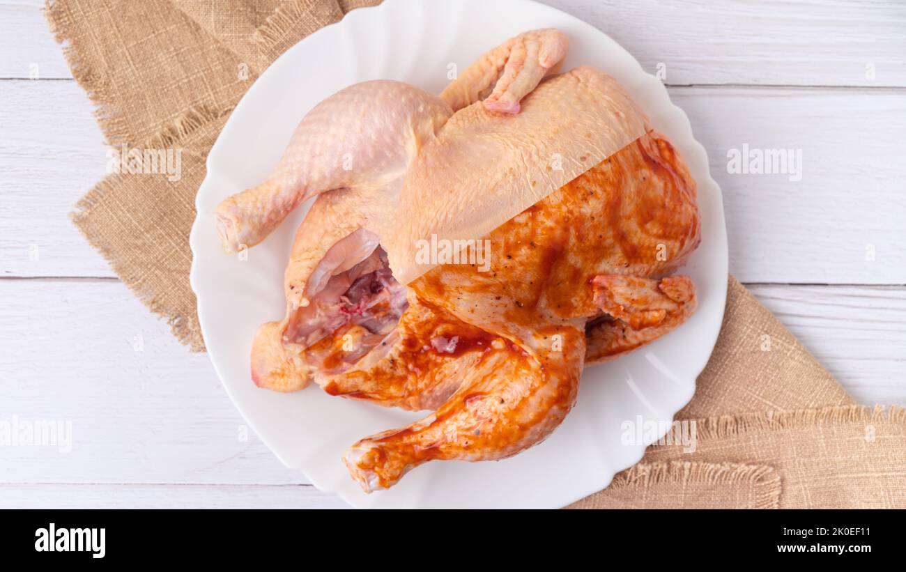 Fresh organic chicken on a half with marinade Stock Photo - Alamy