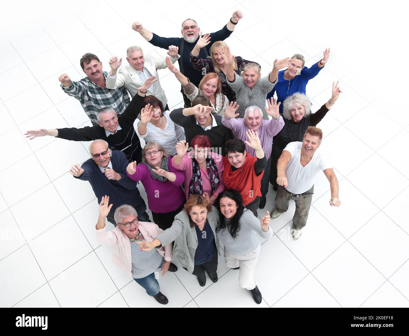 group of happy elderly people standing with their hands up Stock Photo ...