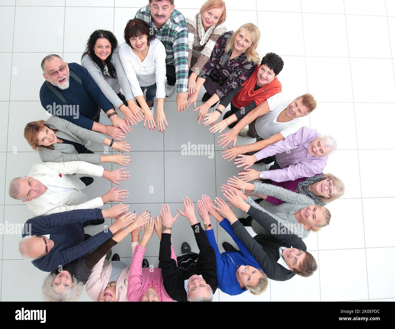 group of mature people showing their unity Stock Photo - Alamy