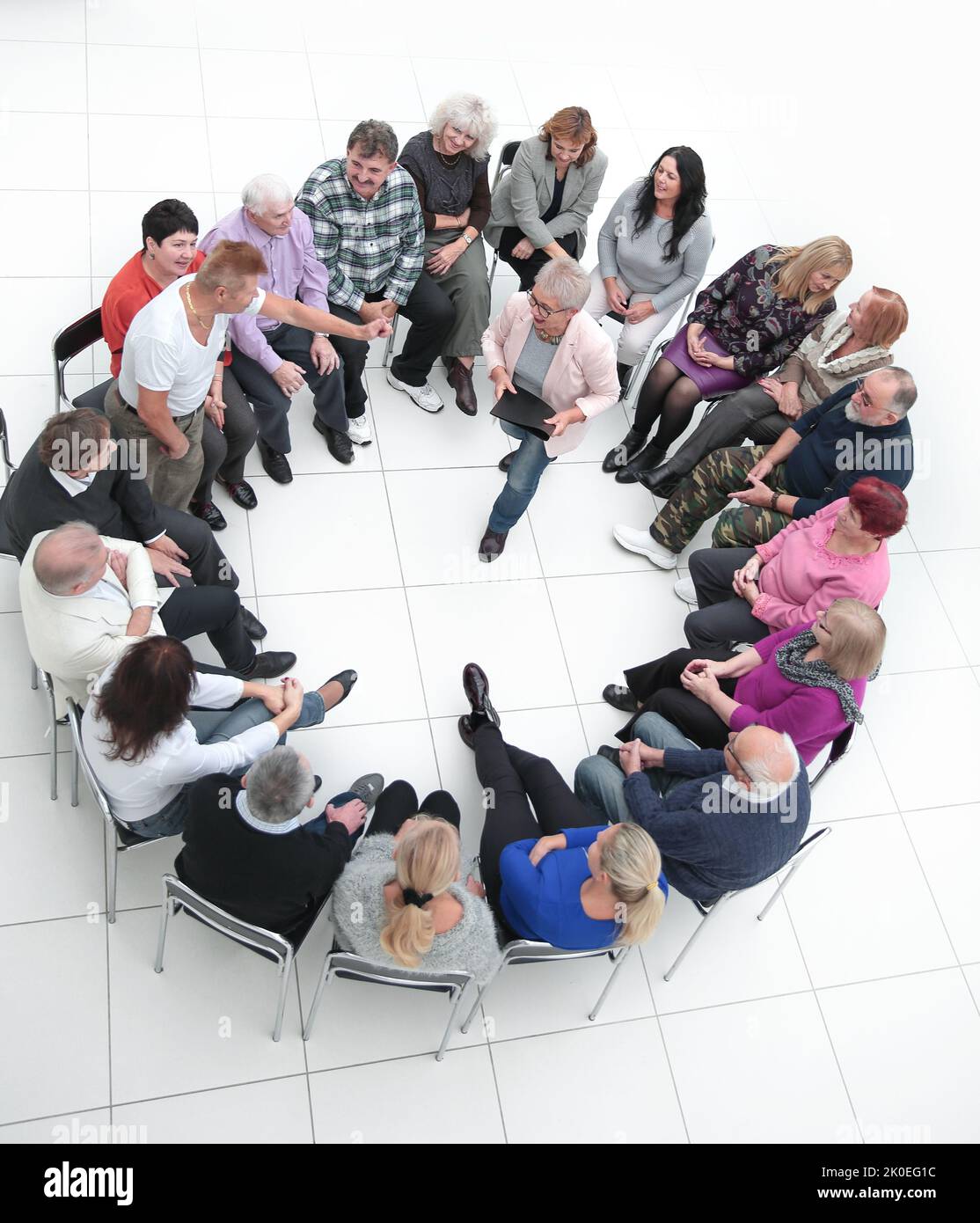 confident older woman standing in a circle of like-minded people Stock ...