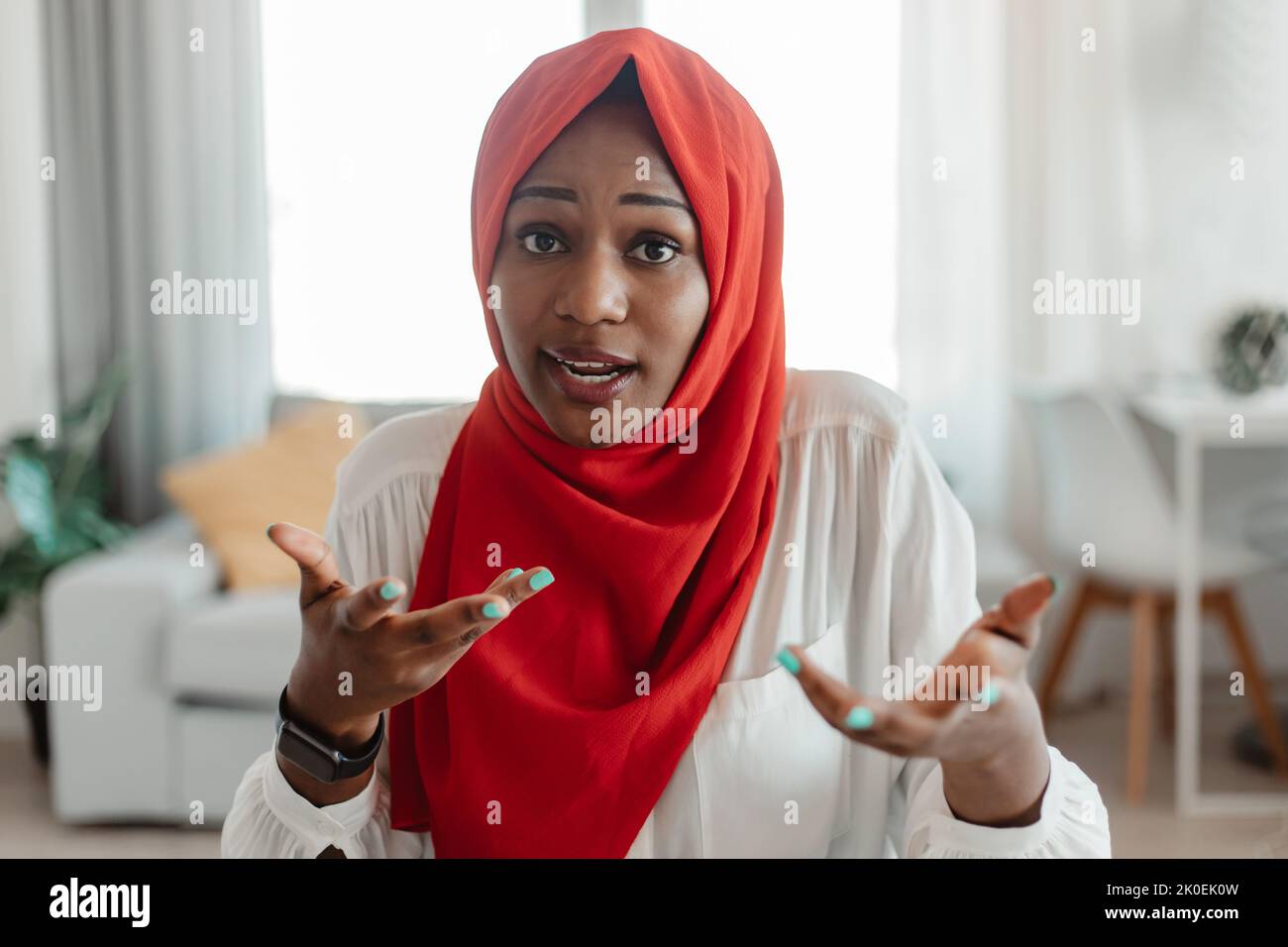 African american muslim woman talking emotionally and gesturing at ...