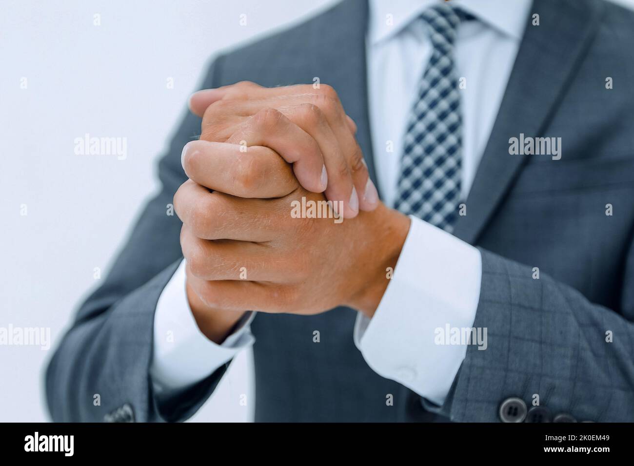 Close up on male clenched hands Stock Photo - Alamy