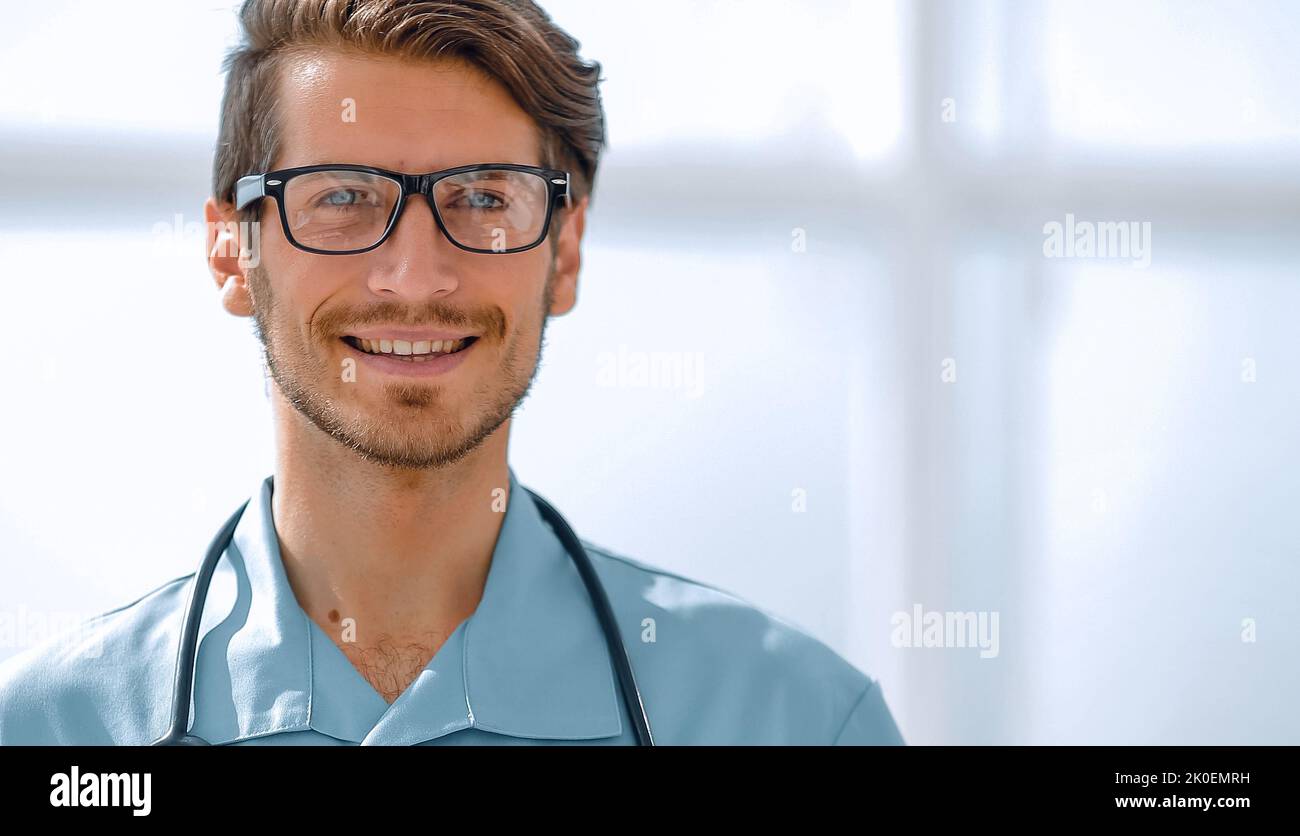 surgeon man in blue uniform standing in the hall Stock Photo - Alamy