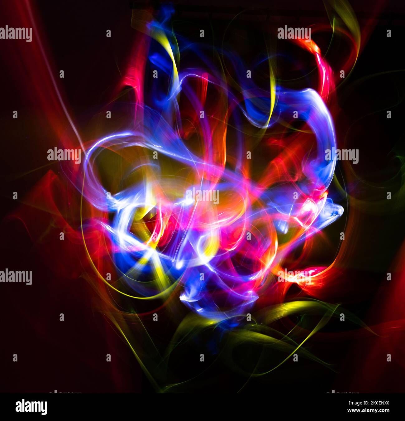Abstract shapes of light. Circular lines forming a nebula of colored ...