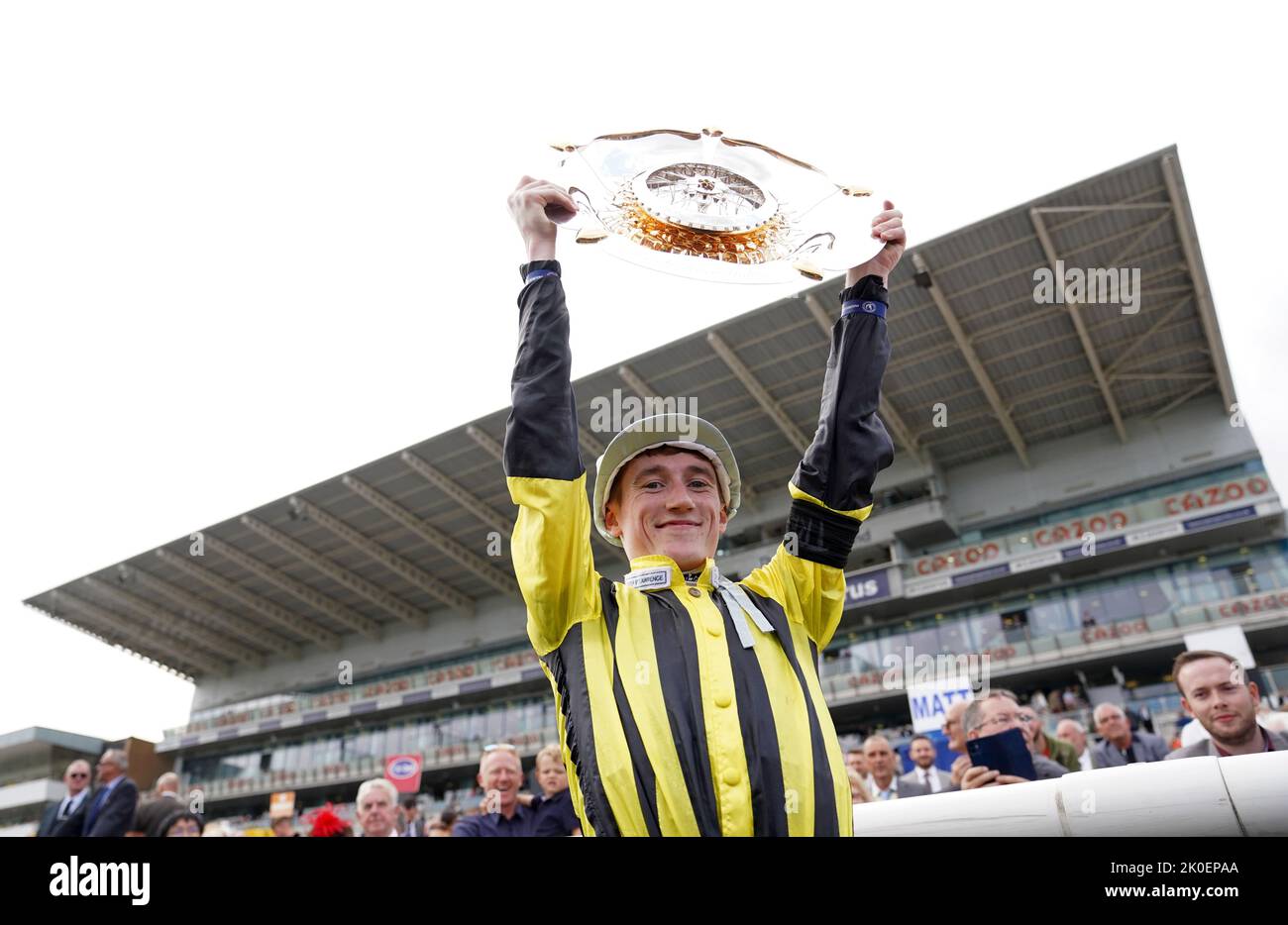 Davin Egan lifts the trophy after winning the Cazoo St Leger Stakes ...