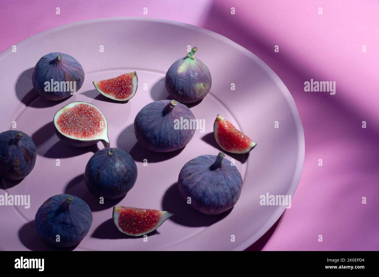 Fresh ripe figs in a plate. Healthy Mediterranean fig fruit. Copy space ...