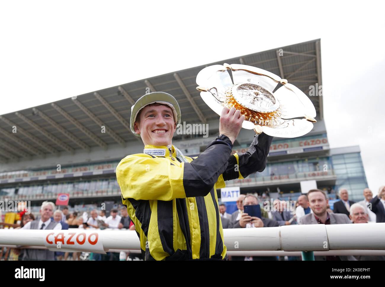 Davin Egan lifts the trophy after winning the Cazoo St Leger Stakes ...