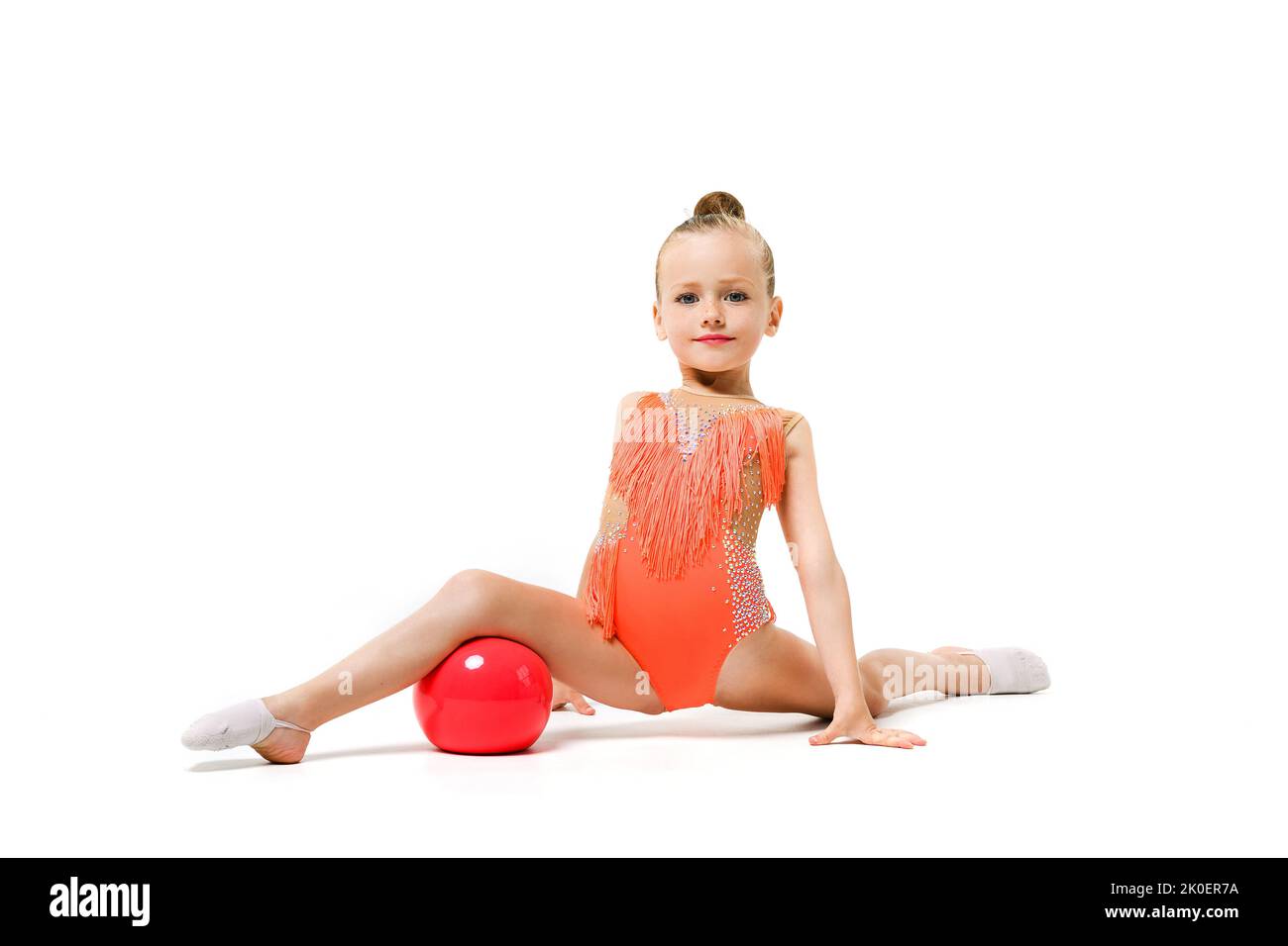 Little flexible gymnast girl sit in split Stock Photo - Alamy