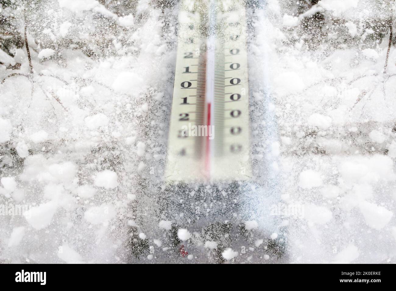 Defocus winter thermometer. Winter time. Thermometer on snow shows low ...