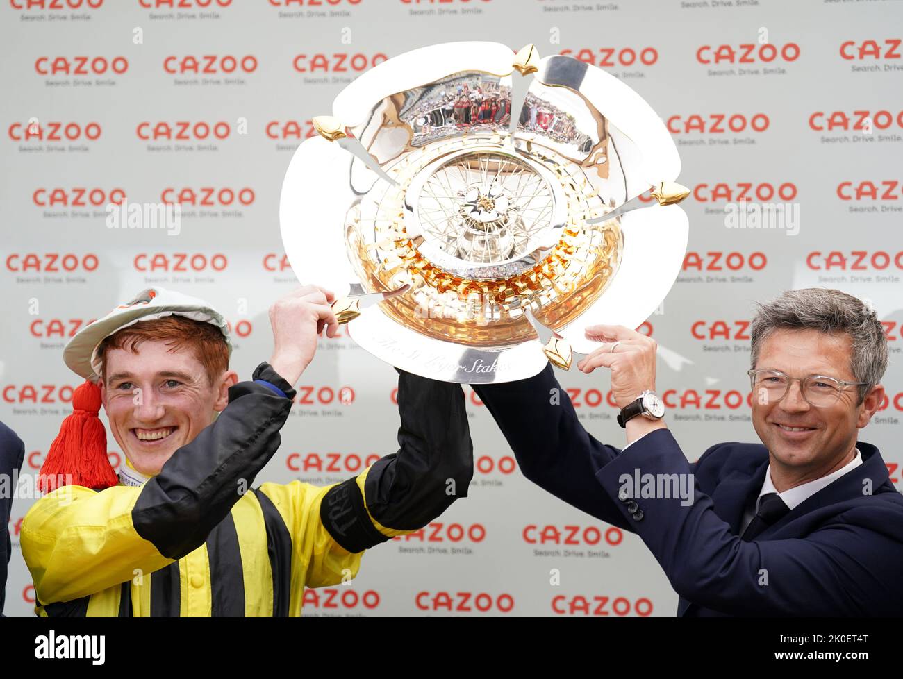 David Egan and Roger Varian lift the trophy after winning the Cazoo St ...