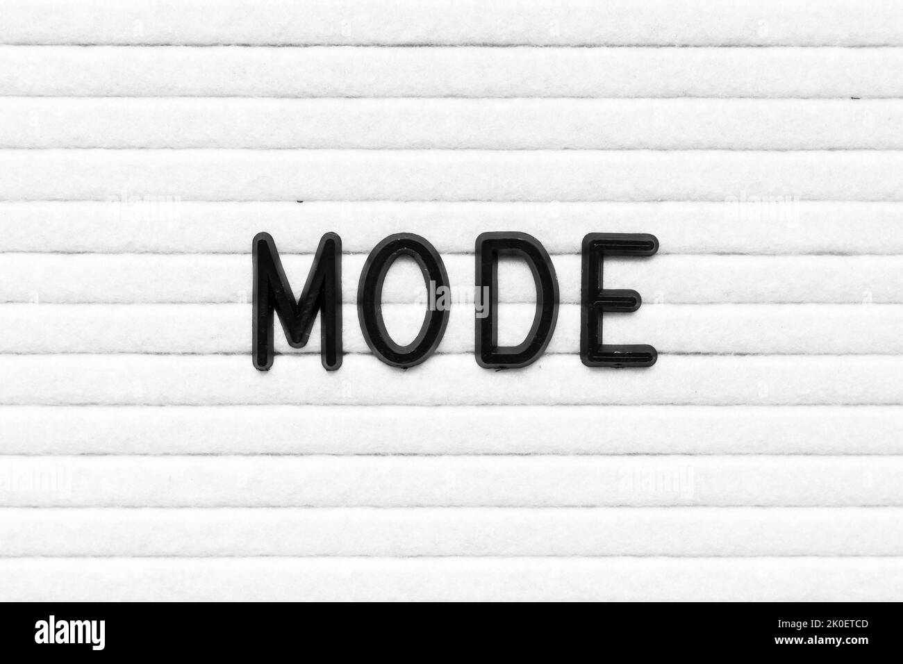 Black alphabet letter in word mode on white felt board background Stock ...
