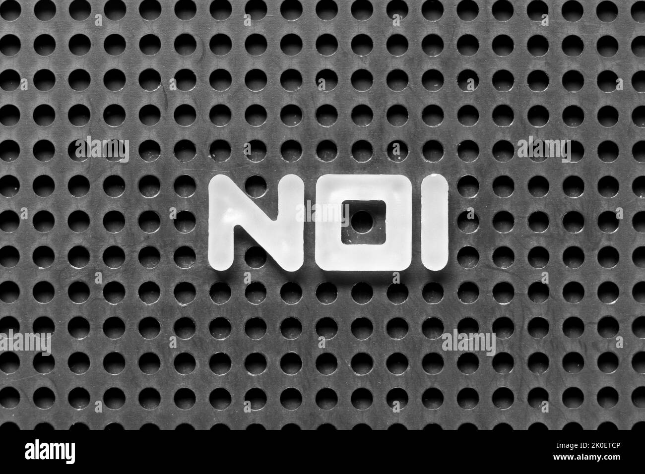 White alphabet letter in word NOI (Abbreviation of Net operating income ...