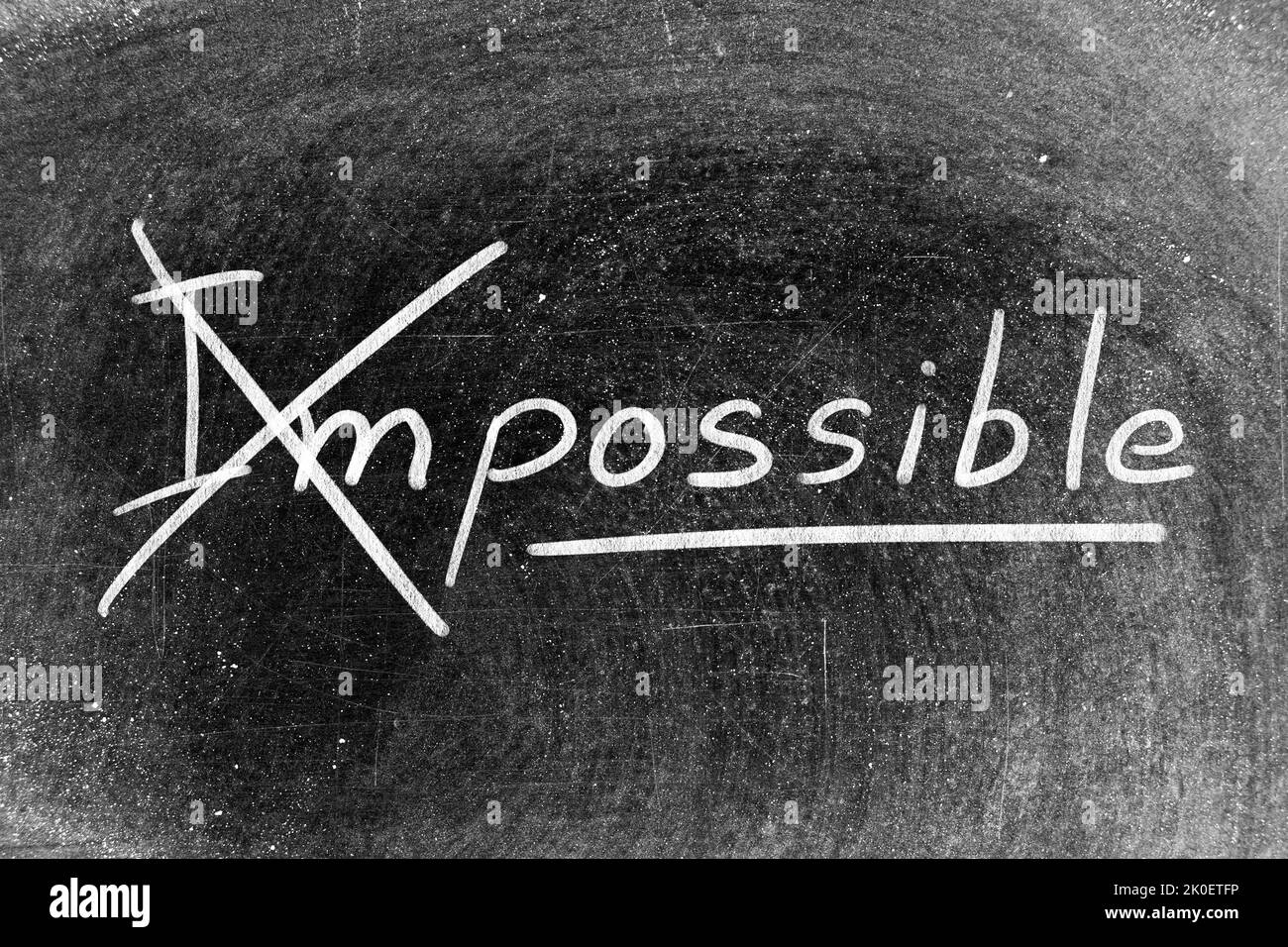 White chalk hand writing in word impossible that cross im to be ...