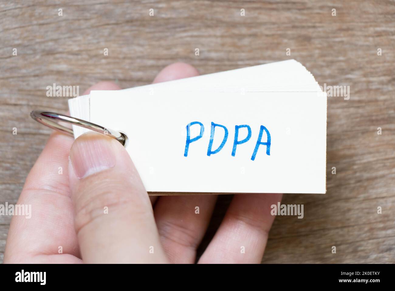 Hand hold flash card with handwriting in word PDPA (Abbreviation of ...