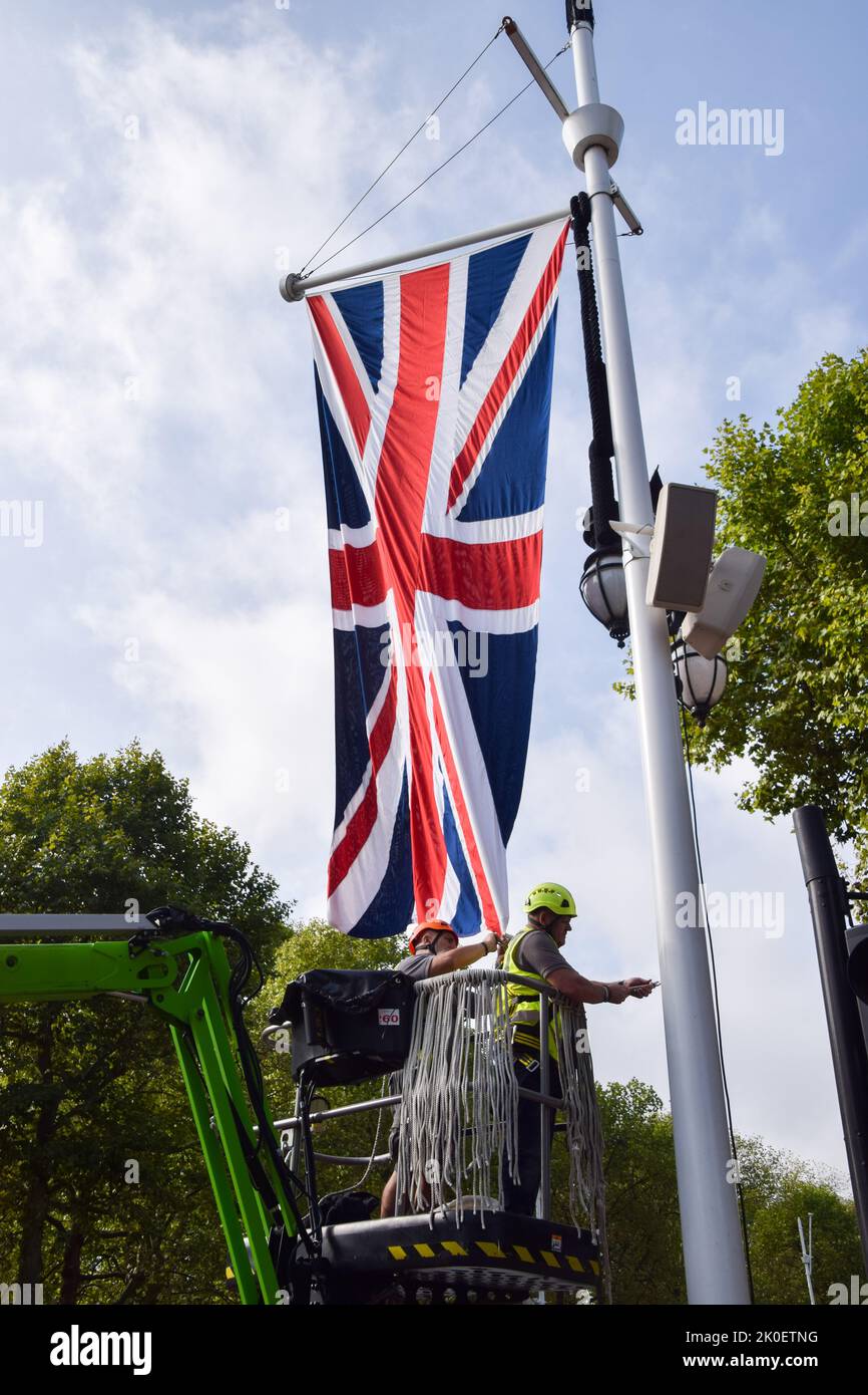 London, UK. 11th Sep, 2022. Workers install Union Jacks along The Mall ...