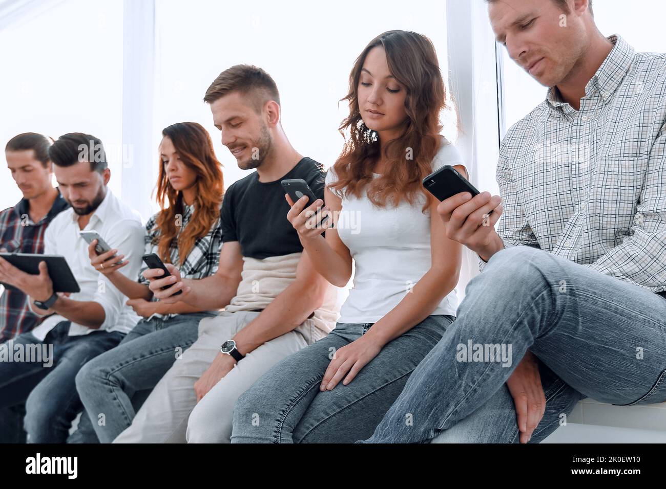 business team using a mobile device Stock Photo - Alamy