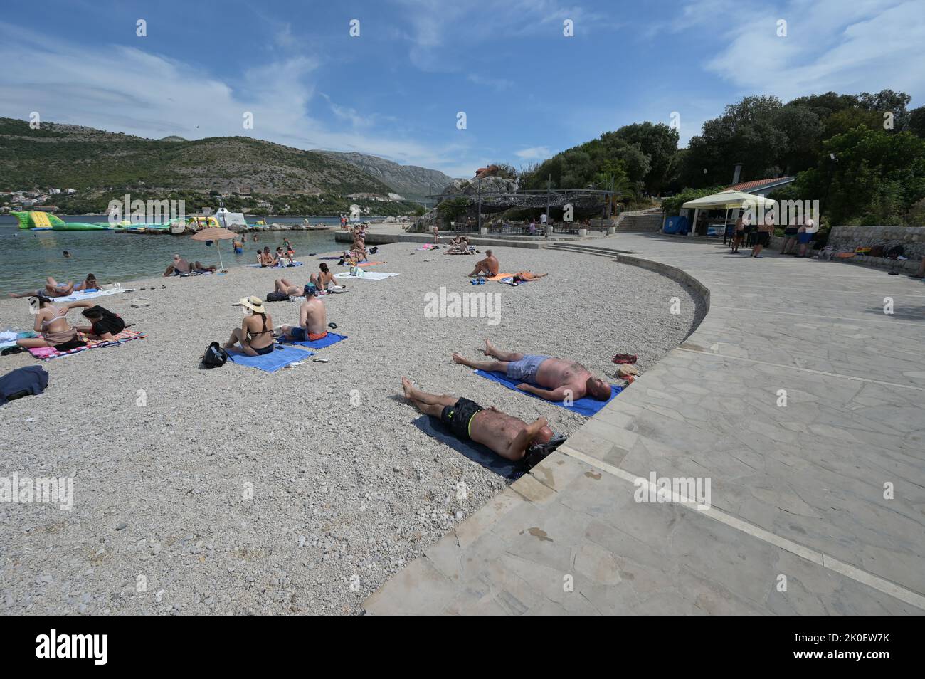 People sunbathing on holiday on a beach in Croatia Stock Photo - Alamy