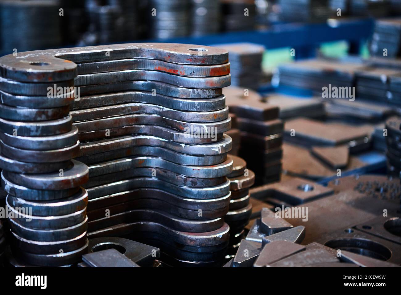 Piles of different workpieces made of metal material sheet Stock Photo ...