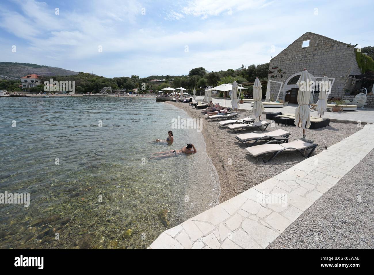 People sunbathing on holiday on a beach in Croatia Stock Photo - Alamy