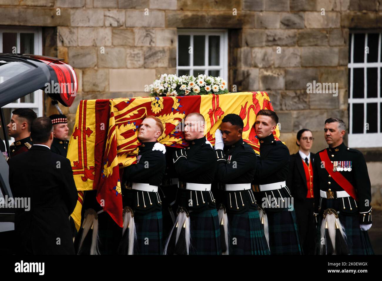 Pallbearers carrying the coffin of Queen Elizabeth II, draped with the ...