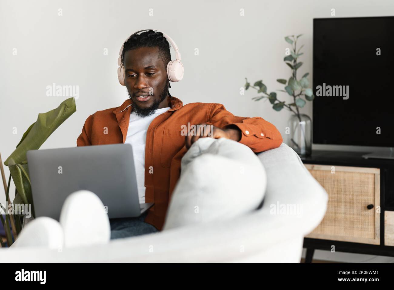 Focused black businessman wearing headphones hi-res stock photography ...