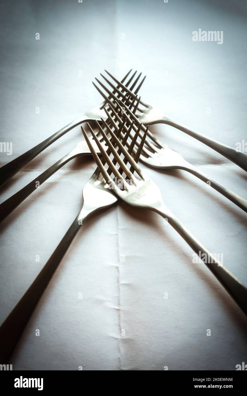 Creative photography with crossed forks Stock Photo - Alamy