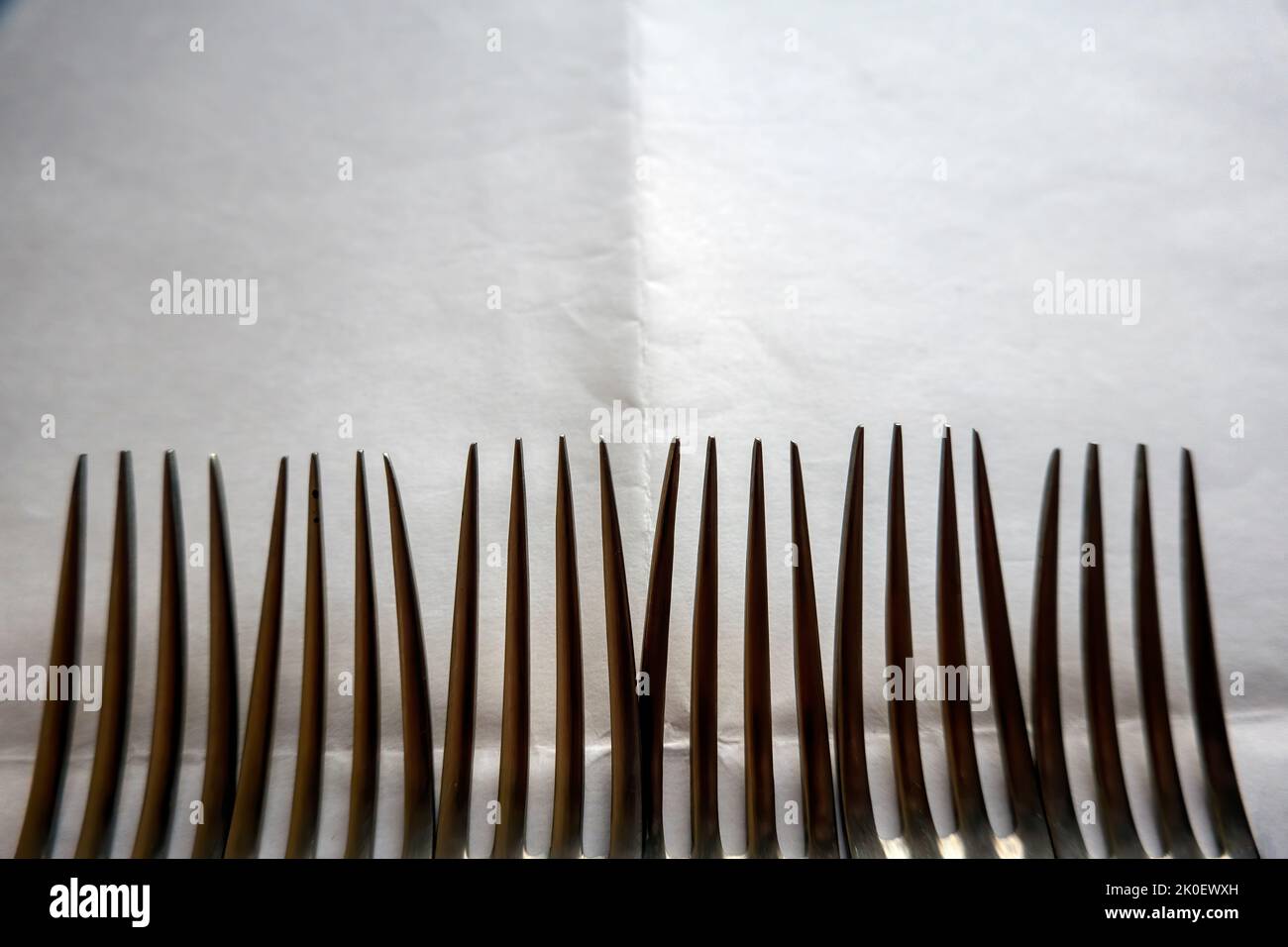 White background on which the skewers of various forks poke out Stock ...