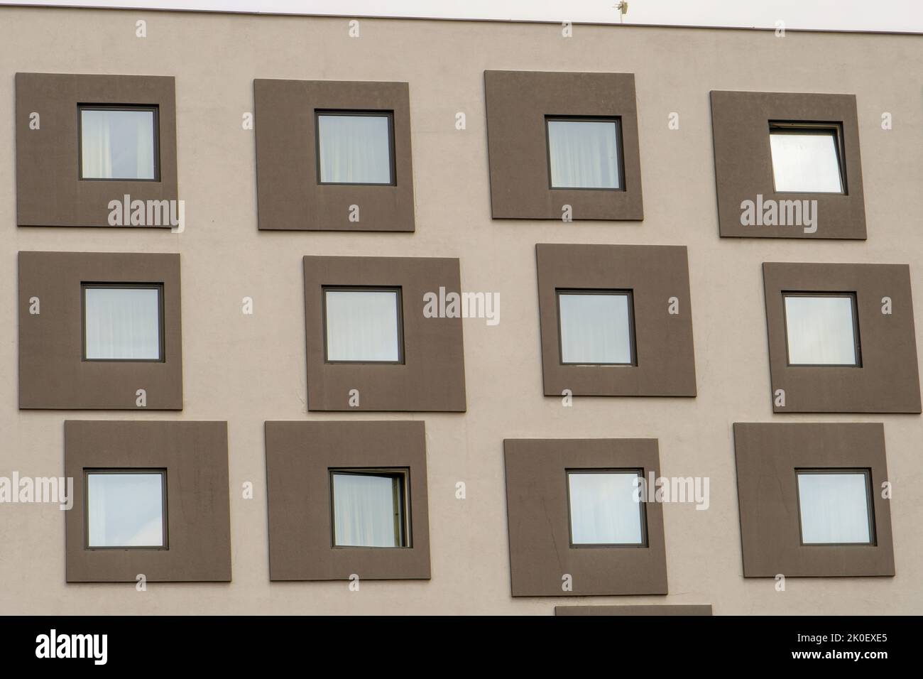 Exterior view of a modern brown and light brown city block of flats ...