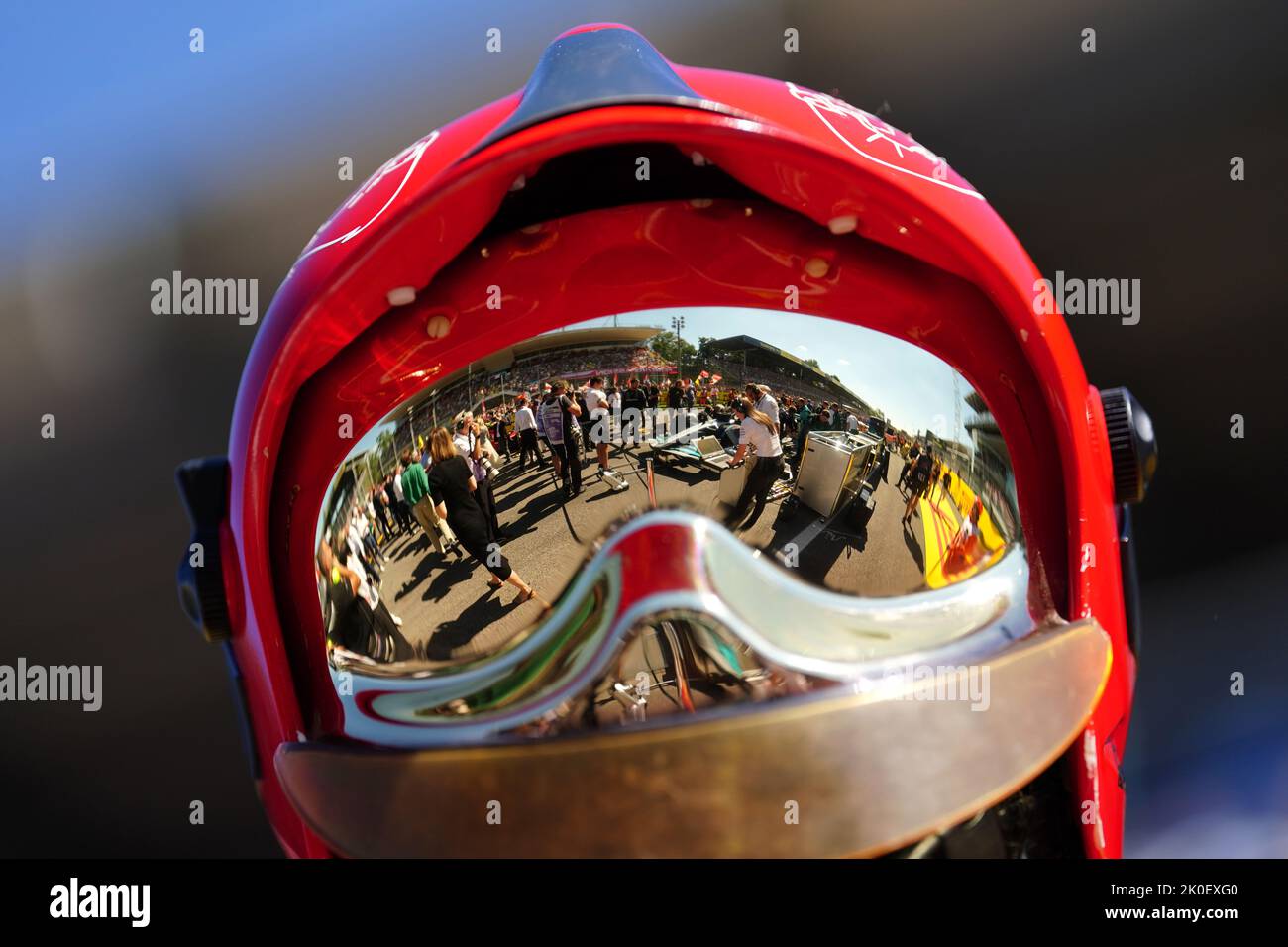 The reflection in the visor of a fire marshal on the grid before the ...