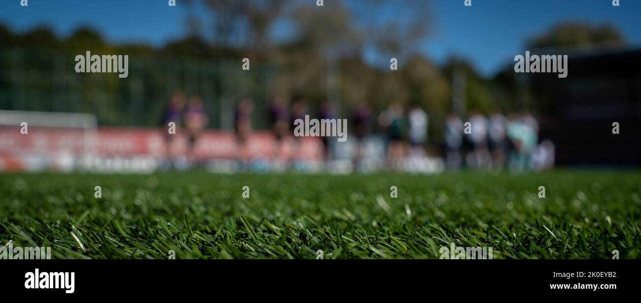 Football background with green grass space for copy and out of focus ...